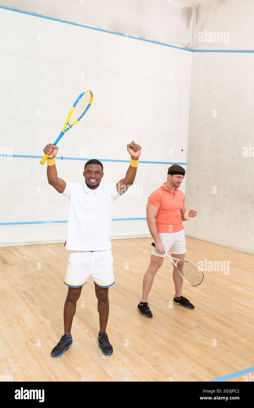Men playing squash Stock Photo - Alamy