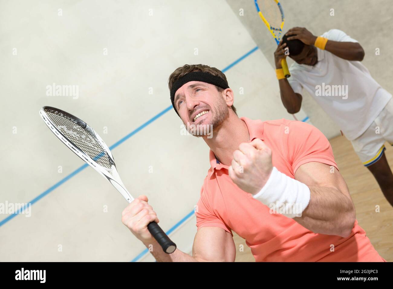 Men playing squash Stock Photo - Alamy