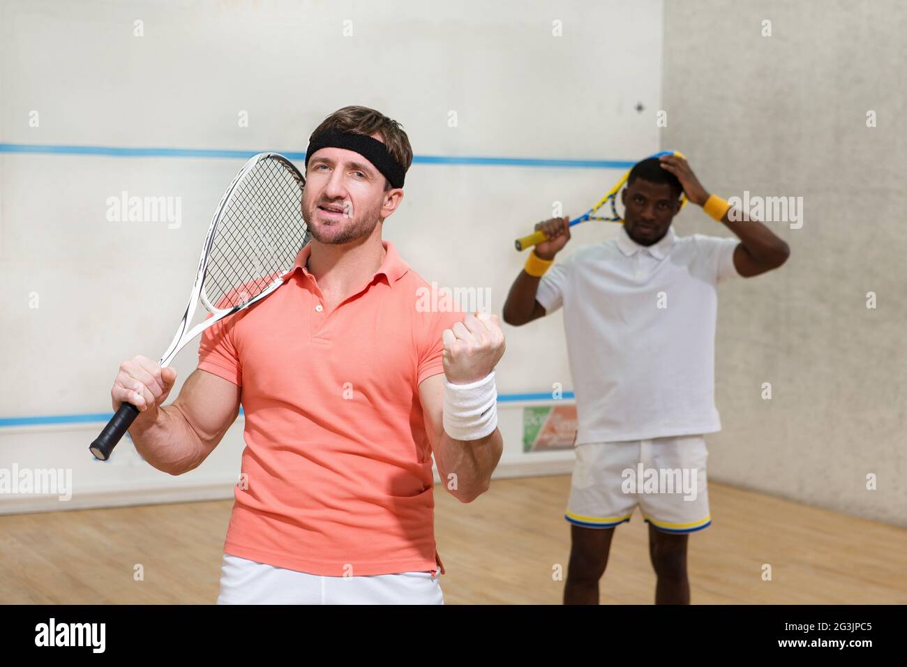 Men playing squash Stock Photo - Alamy