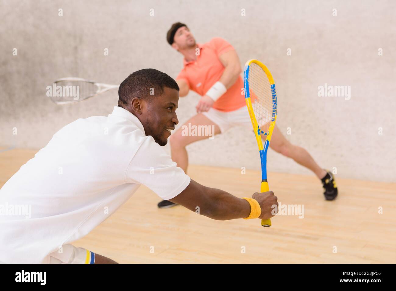 Men playing squash Stock Photo - Alamy