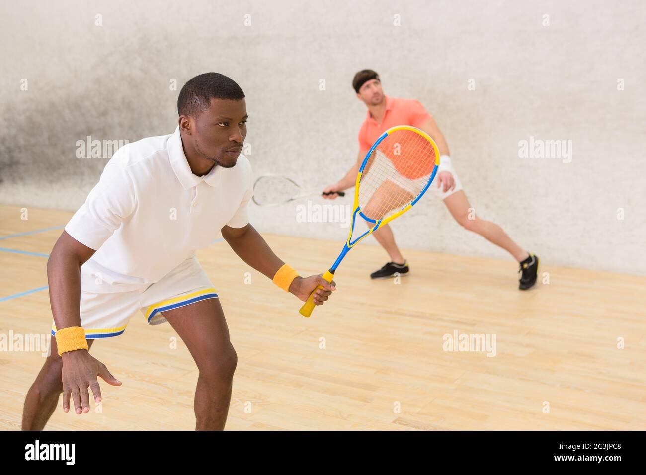 Men playing squash Stock Photo - Alamy