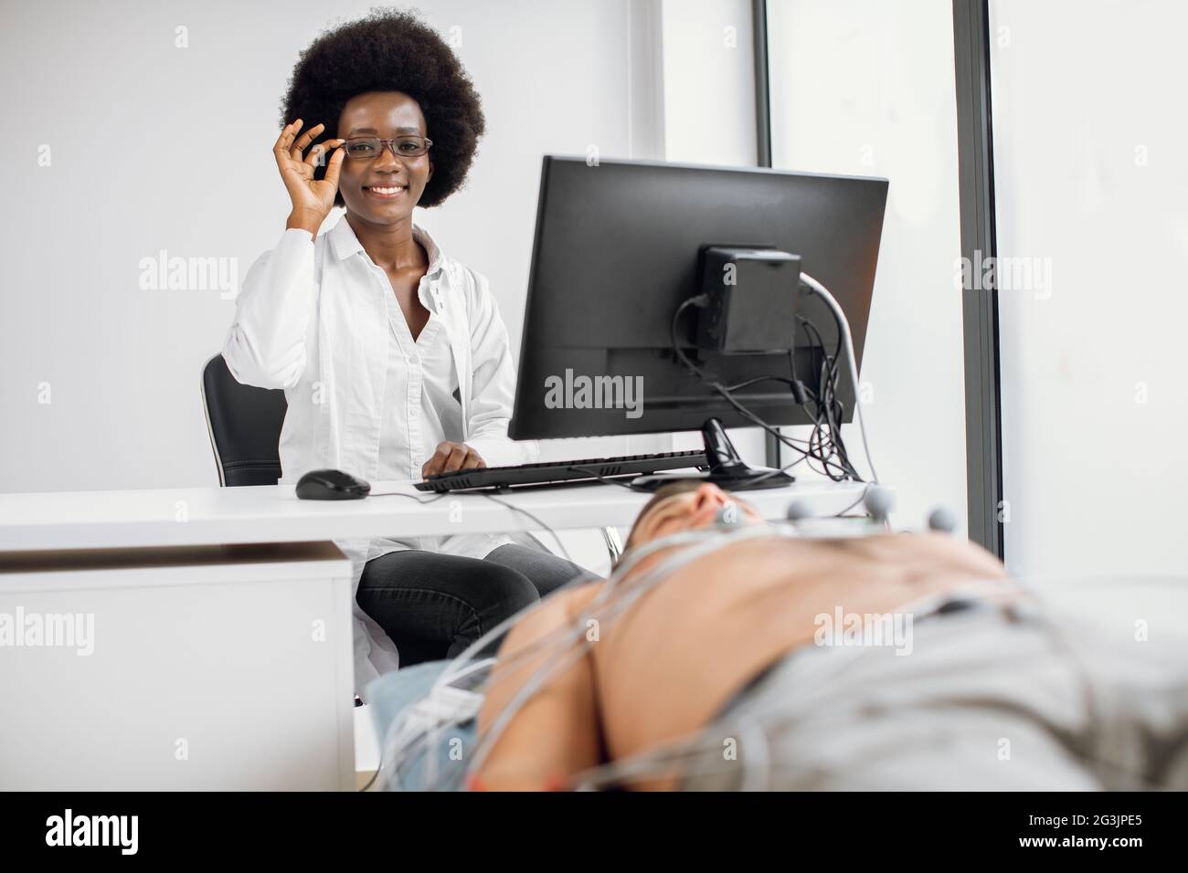 Prevention of cardiovascular diseases. Cheerful female african doctor ...