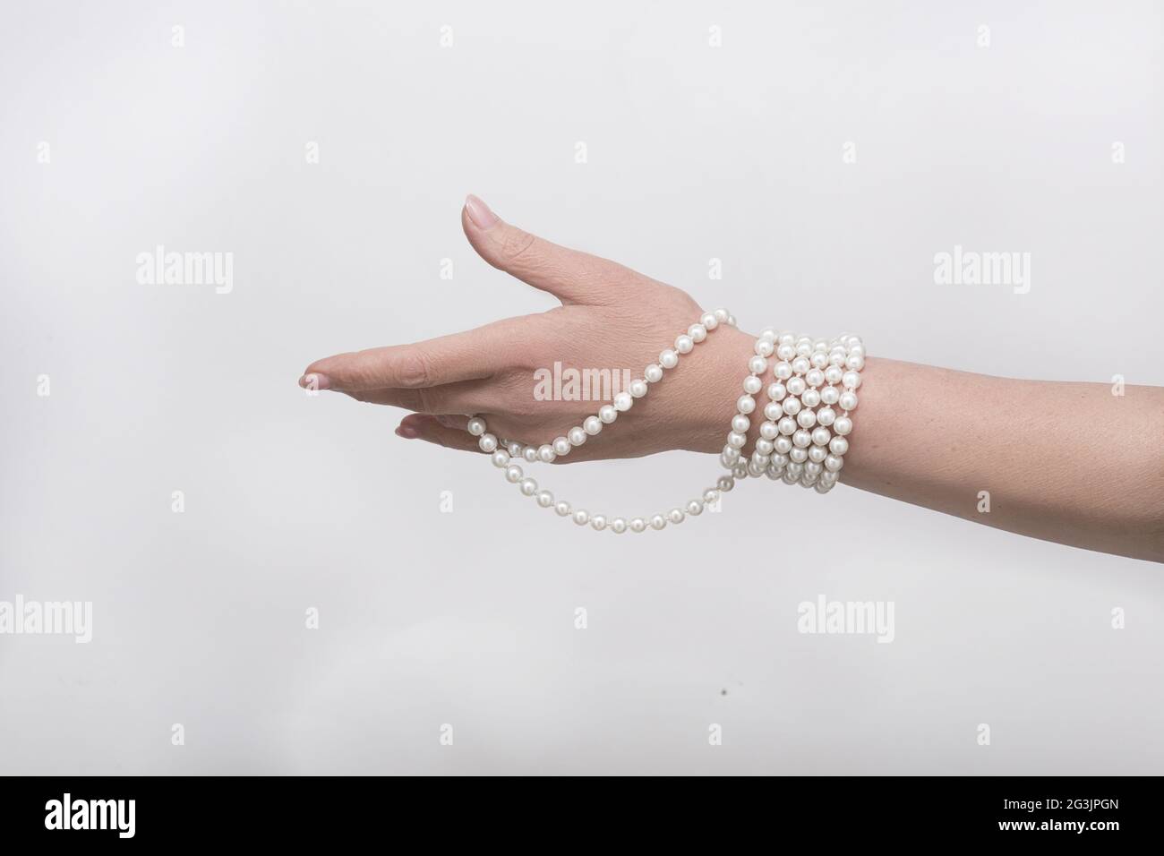 Beads on hand Stock Photo - Alamy