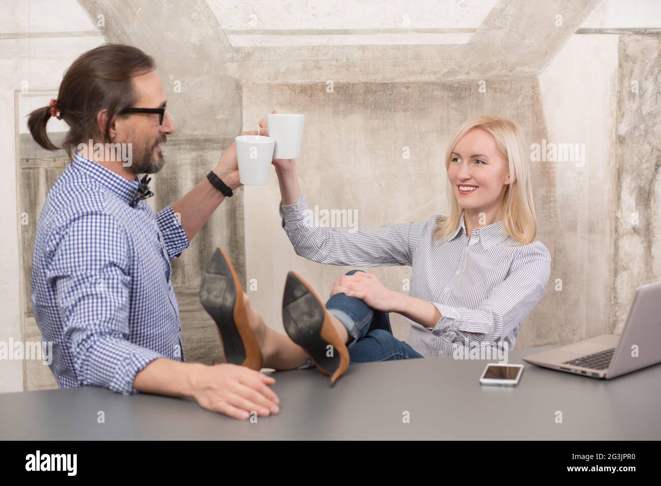 Happy business partners holding hi-res stock photography and images - Alamy