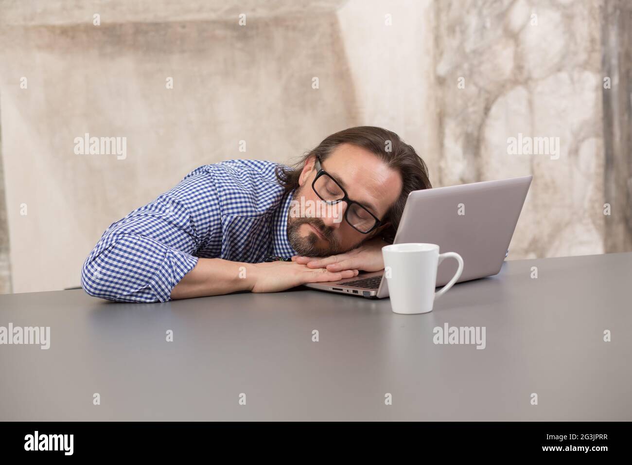 Very tired businessman Stock Photo - Alamy