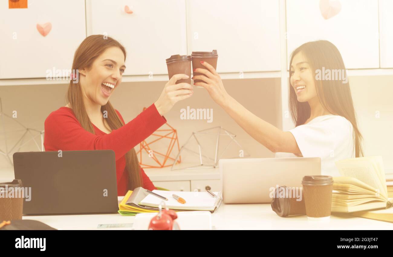 Happy students drinking Stock Photo - Alamy