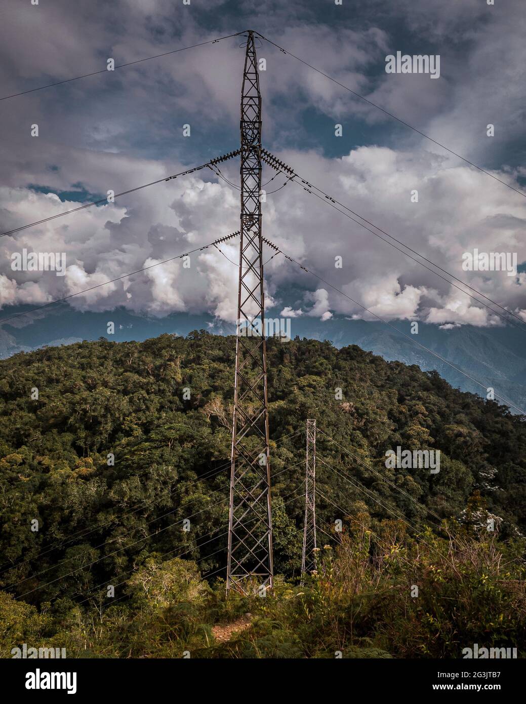 Vertical shot of a large electrical tower in a rural hill area Stock ...