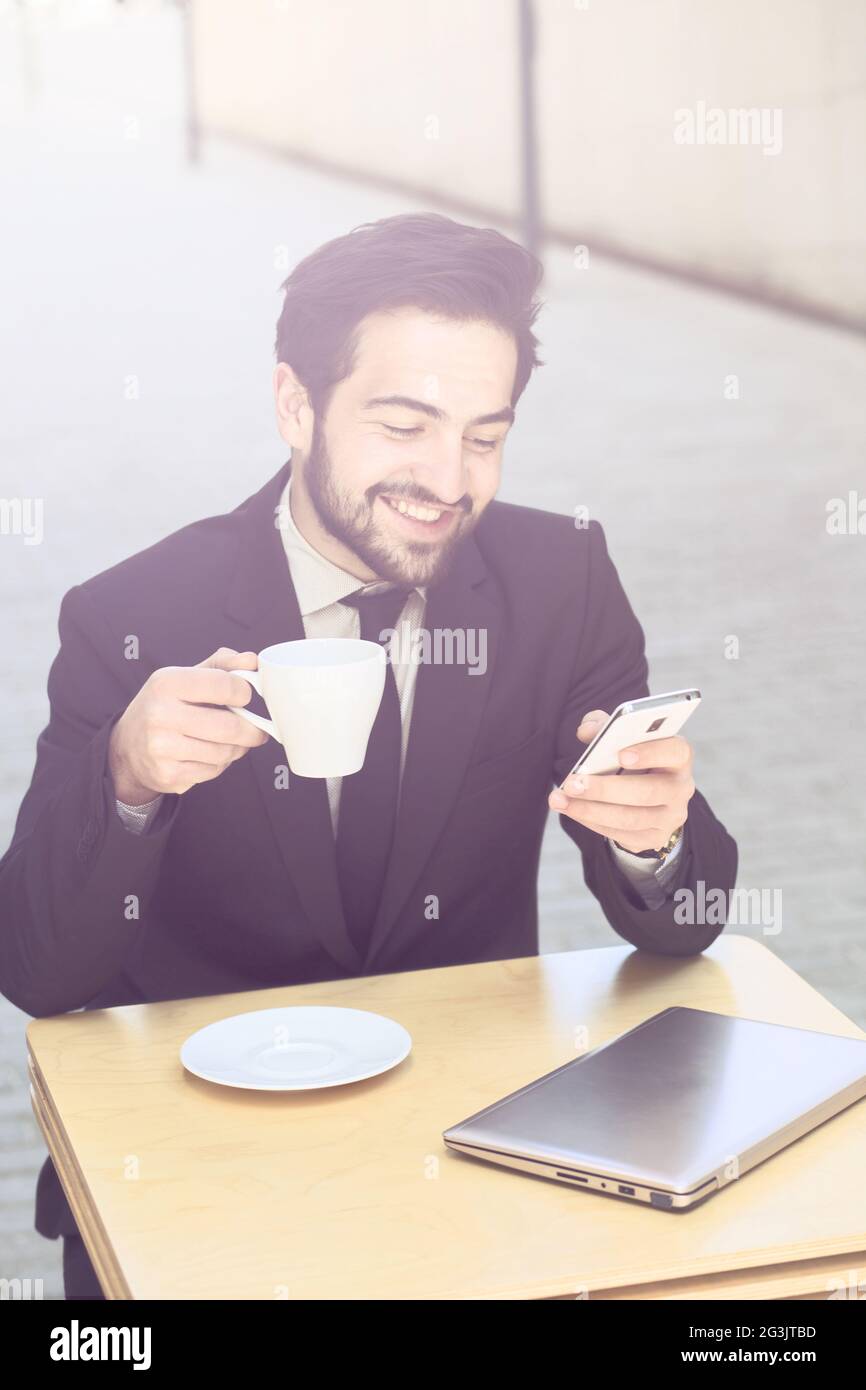 Young manager using phone outdoor hi-res stock photography and images ...