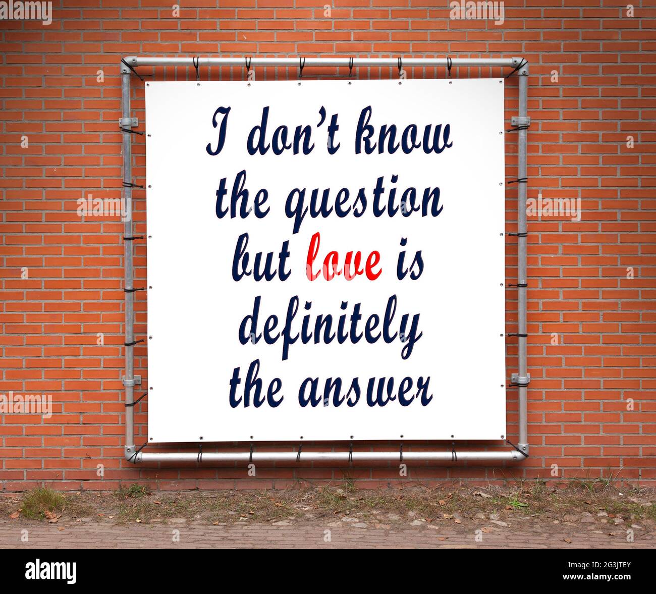 Large banner with inspirational quote on a brick wall Stock Photo - Alamy