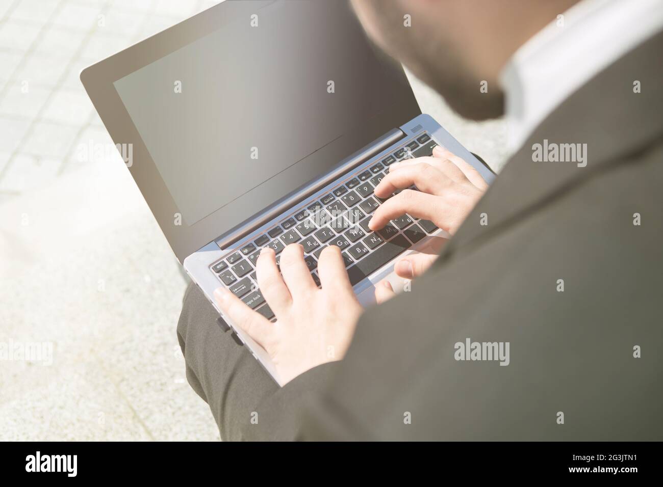 Businessman using laptop computer Stock Photo - Alamy