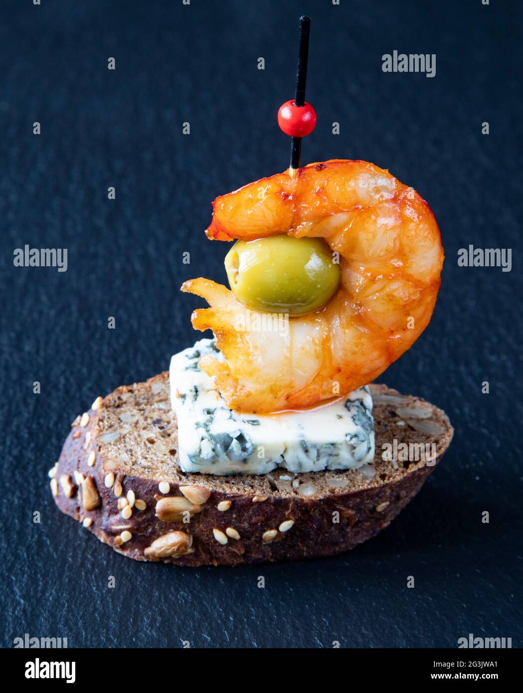 Traditional Spanish food - tapas sandwich consisting of gorgonzola ...