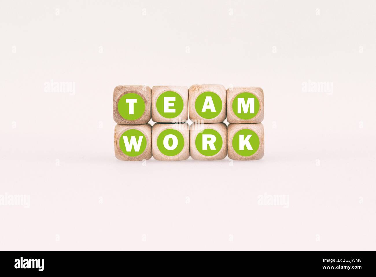 Illustration of eight dices in two rows with text TEAM WORK on white ...