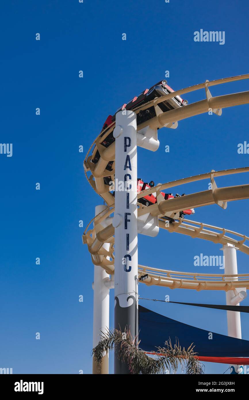 Visitors riding the steel West Coaster at Pacific Park in Santa Monica ...