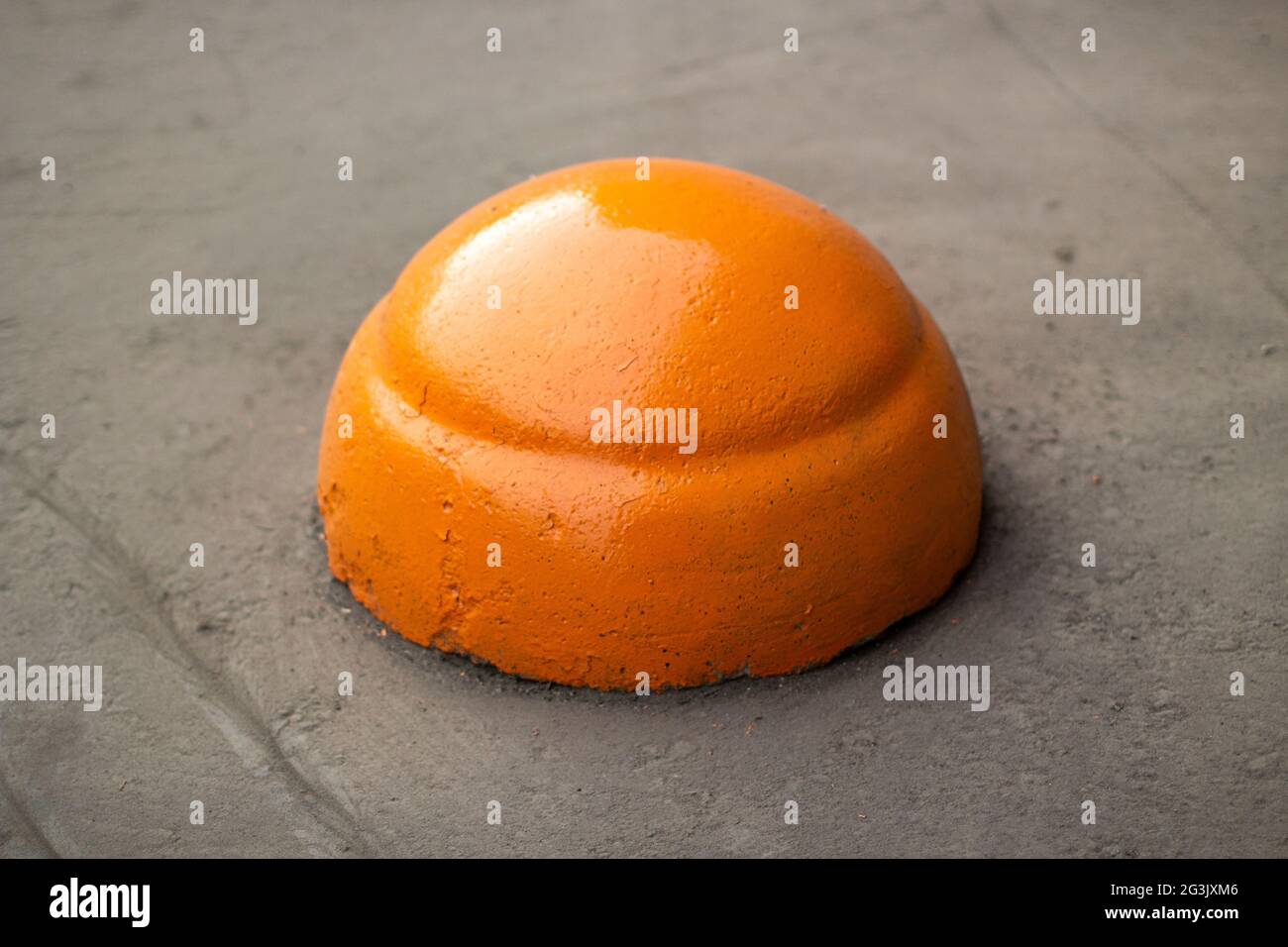 Parking spherical vehicle movement blocker. Orange traffic limiter ...