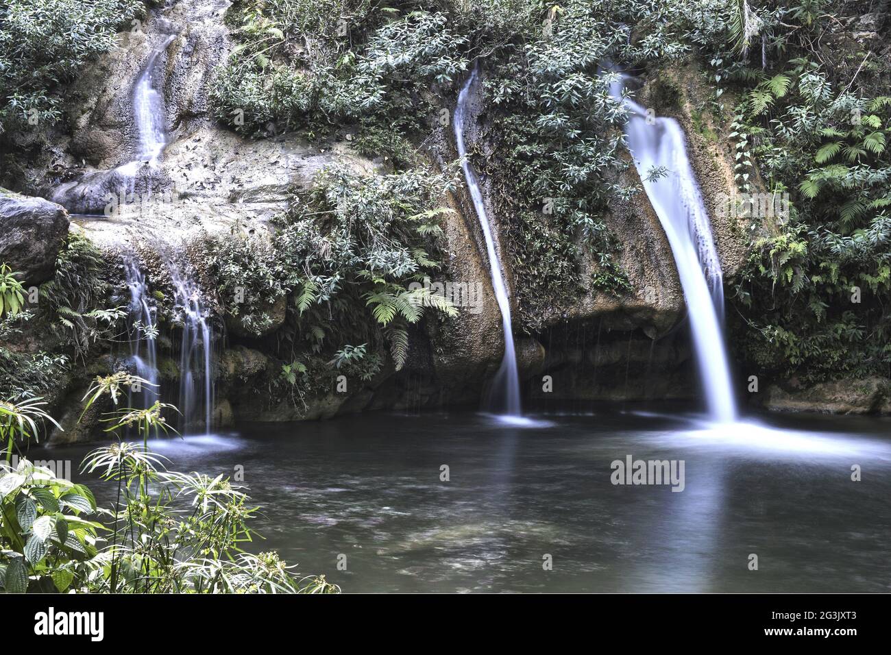 Closeup of a beautifulsegmented waterfalls in a forest Stock Photo - Alamy