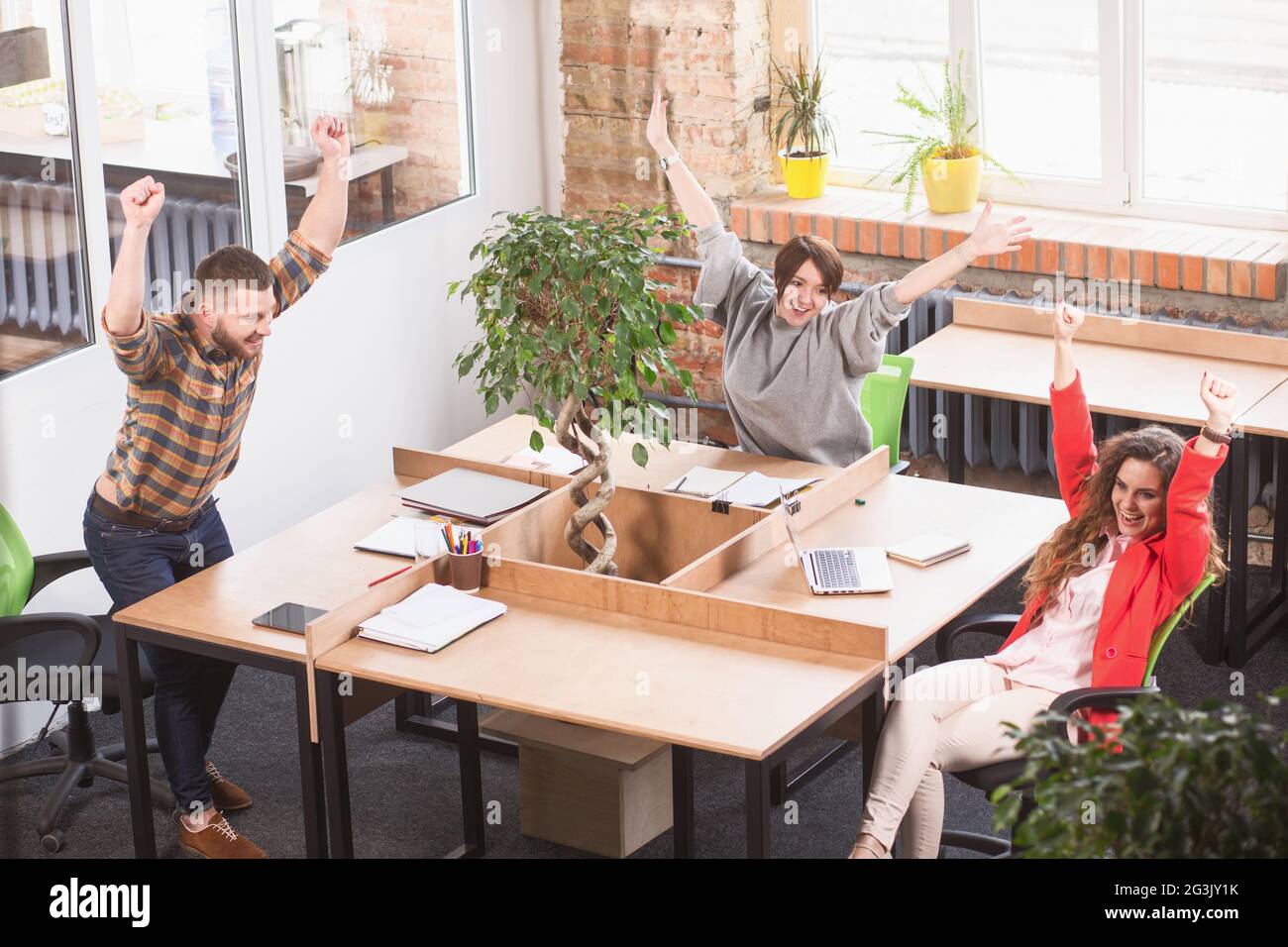Business people showing teamwork in office Stock Photo - Alamy