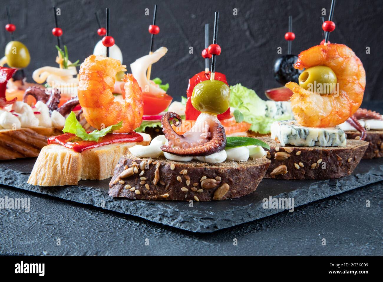 The concept of Mediterranean food - Spanish tapas-sandwiches consisting ...