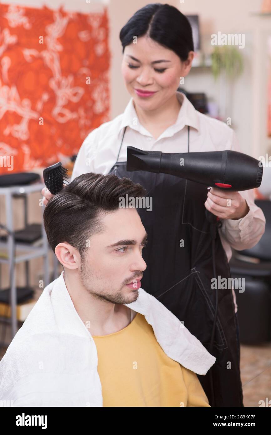 Handsome man in hairdressing saloon Stock Photo - Alamy