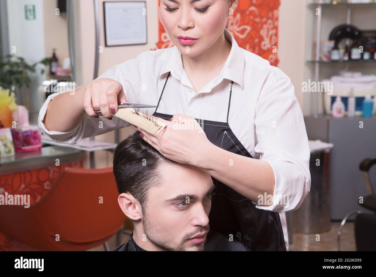 Handsome man in hairdressing saloon Stock Photo - Alamy