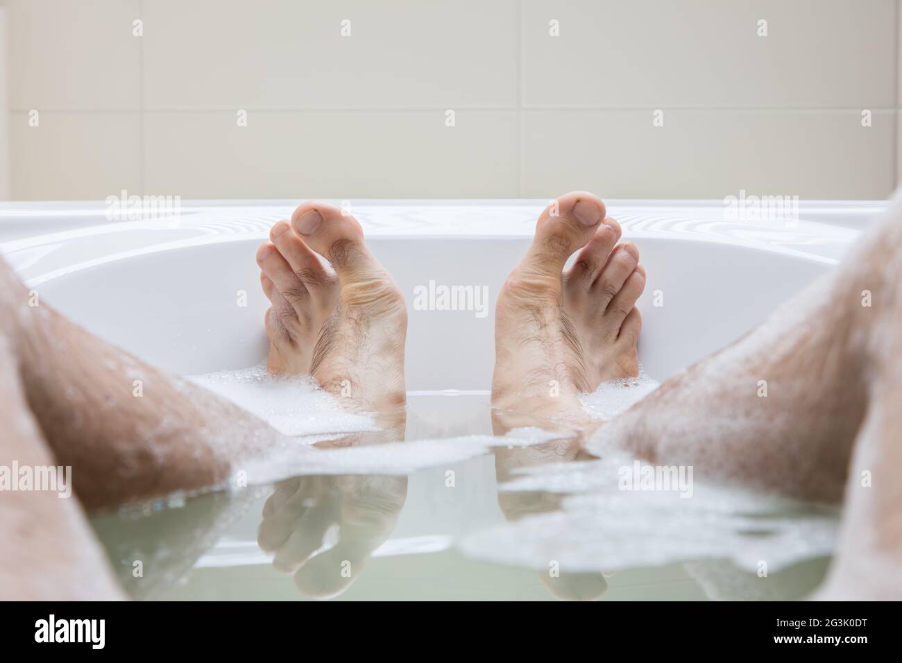 Feet on bathtub hi-res stock photography and images - Alamy