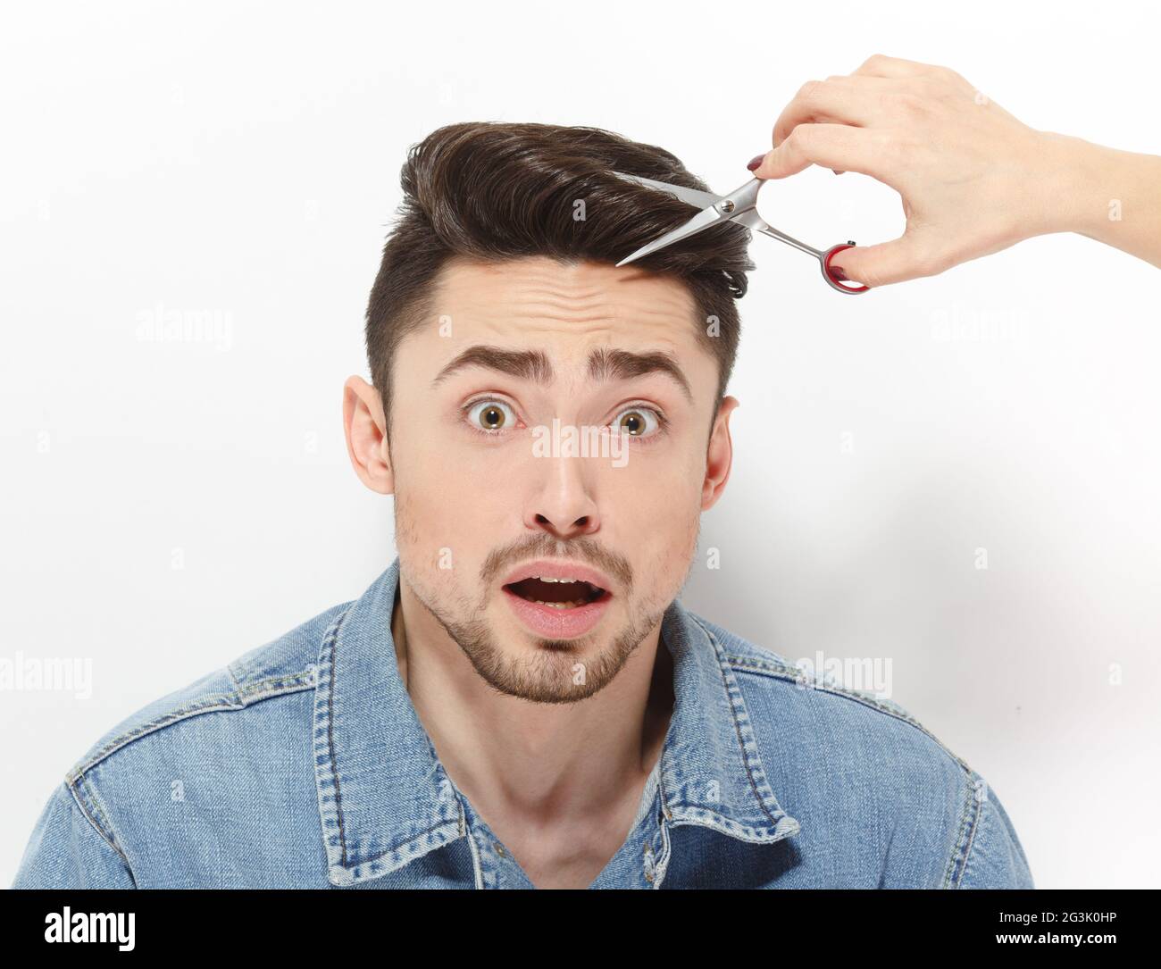 Handsome man having haircut Stock Photo - Alamy