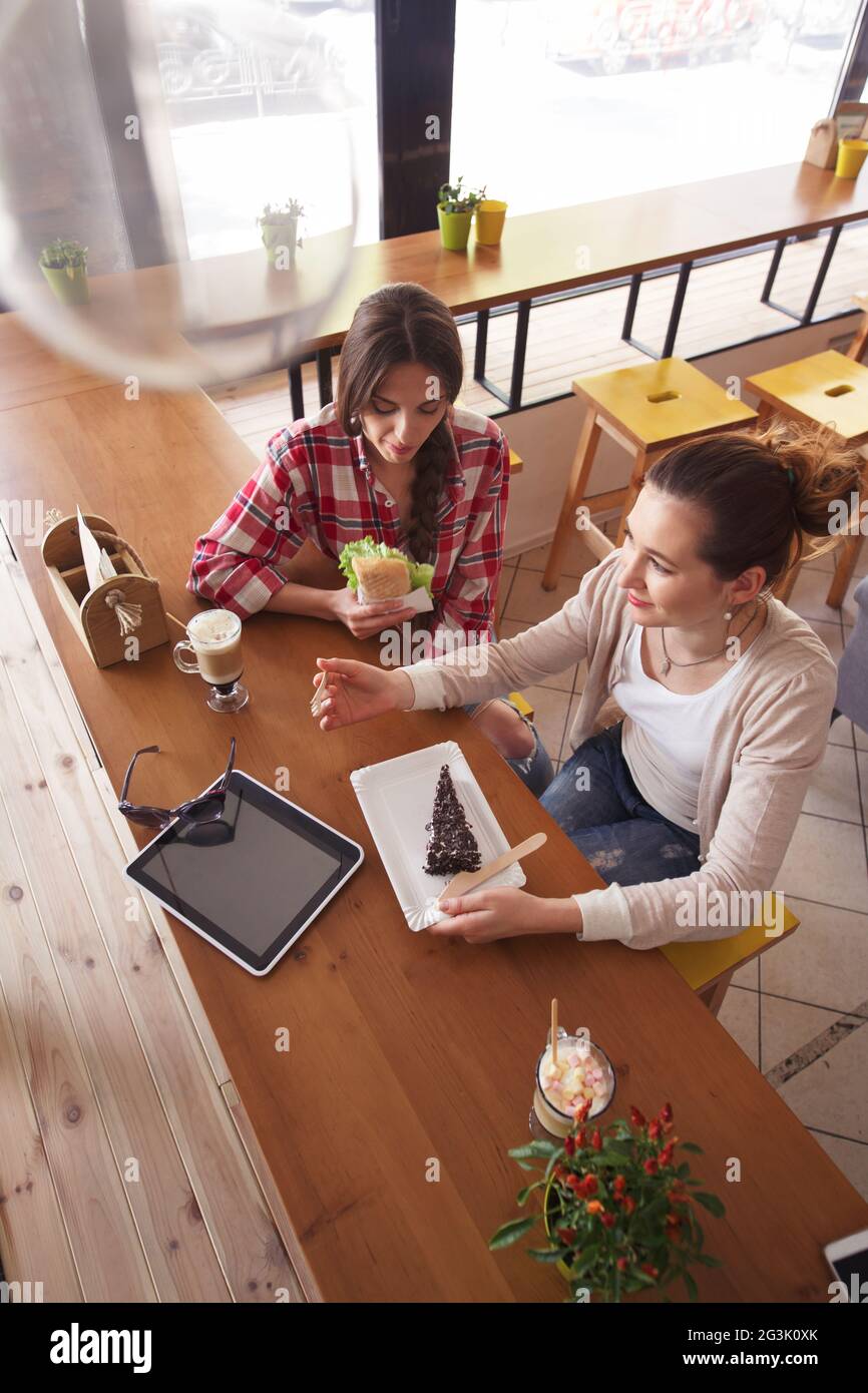 Best friends ladies in cafe Stock Photo - Alamy