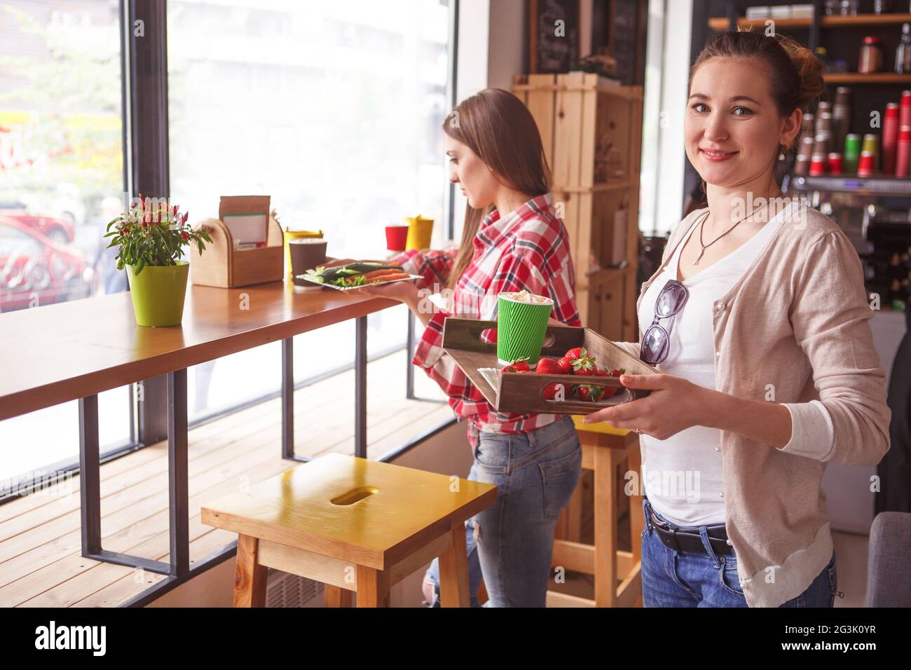 Best friends ladies in cafe Stock Photo - Alamy