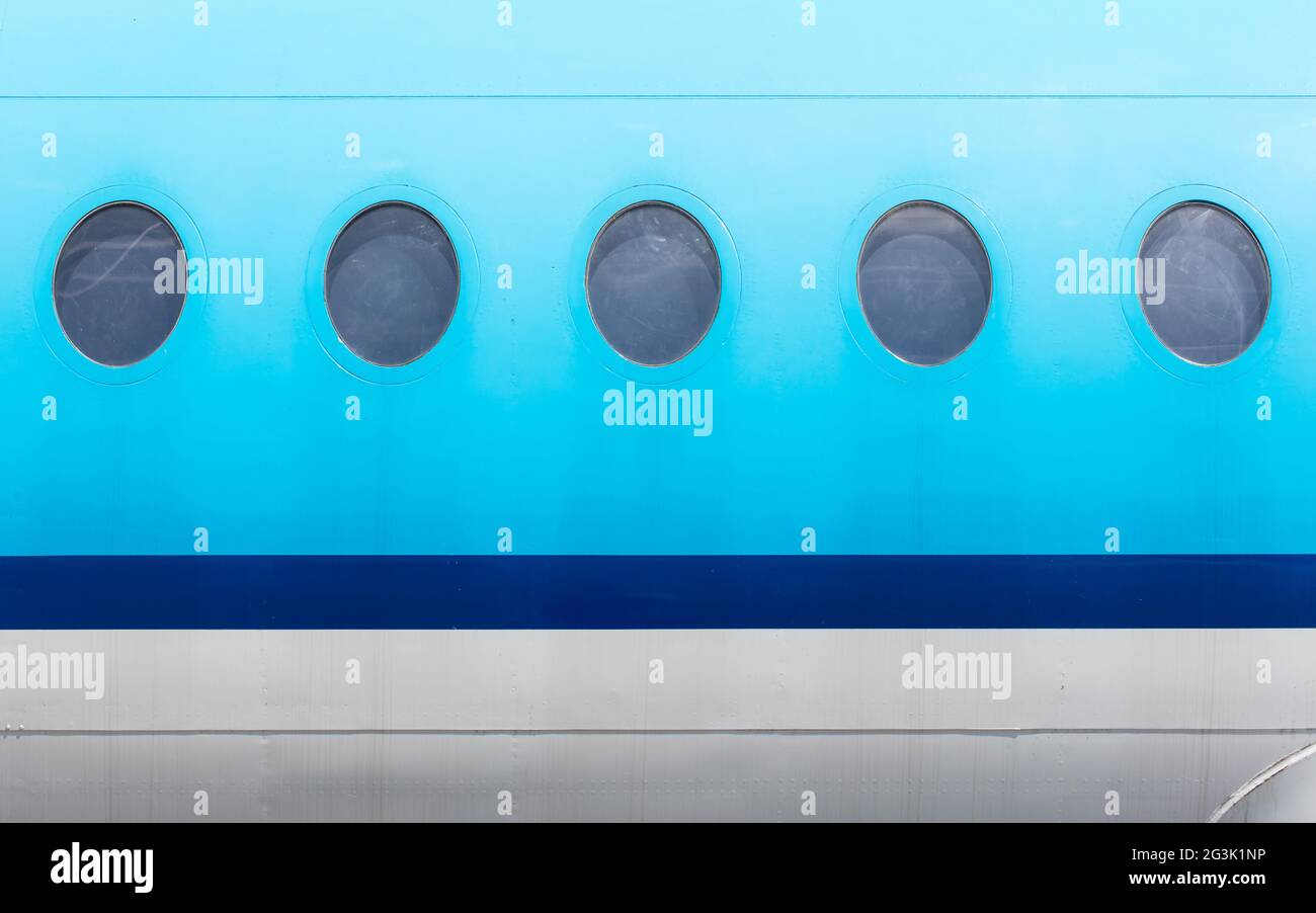 Windows of the blue airplane Stock Photo - Alamy
