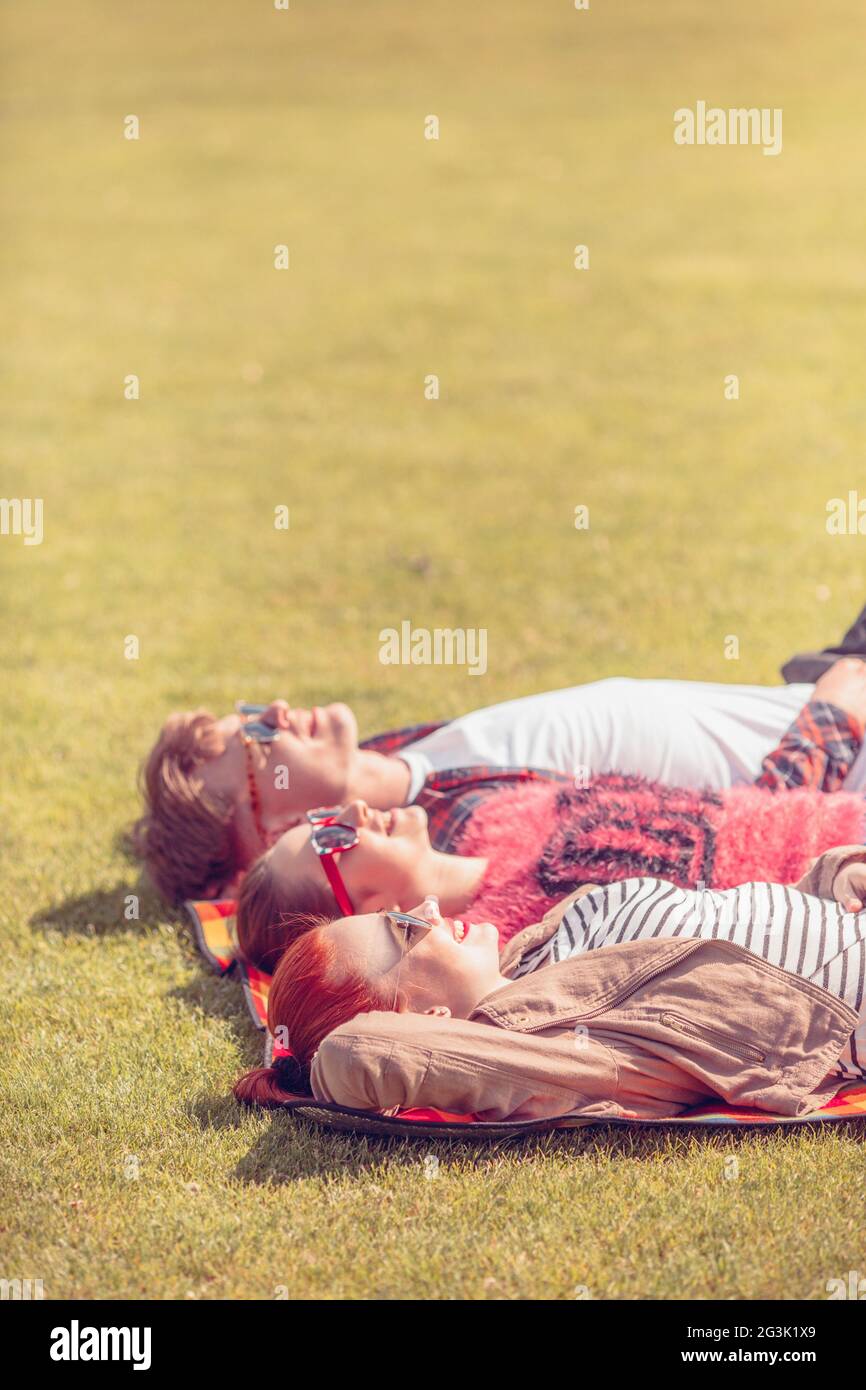Best friends resting in park Stock Photo - Alamy