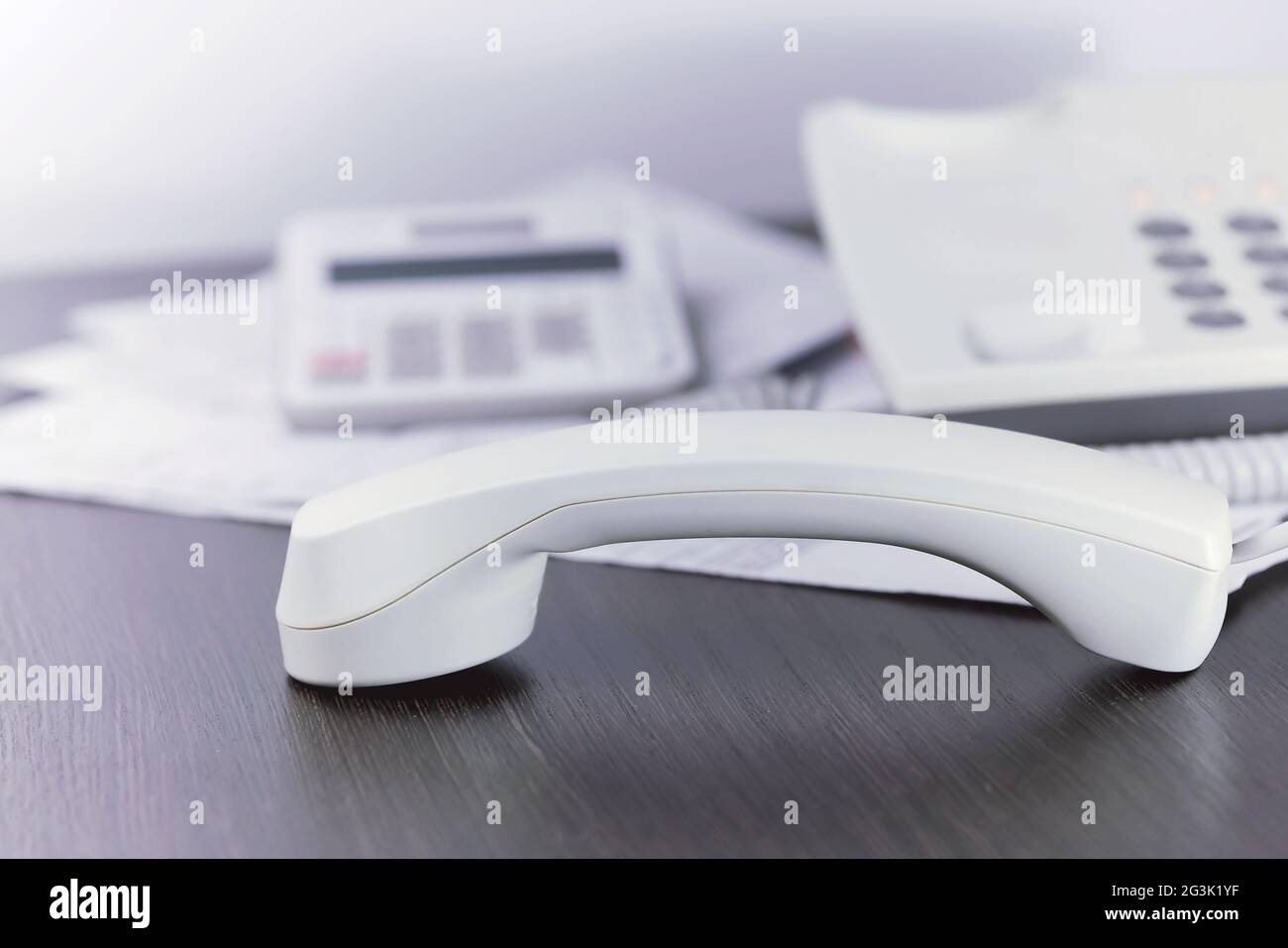 telephone handset on desk in office, toned Stock Photo - Alamy