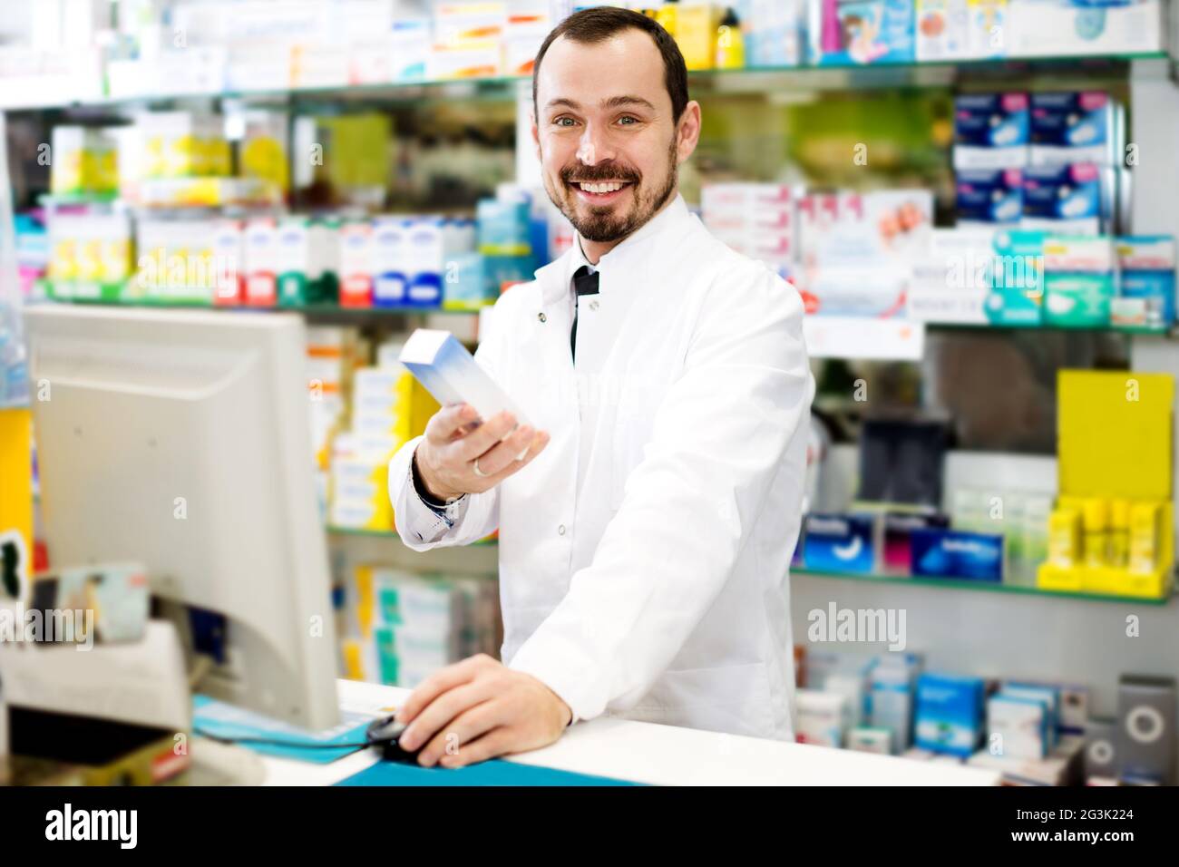 Male pharmacist checking assortment of drugs Stock Photo - Alamy