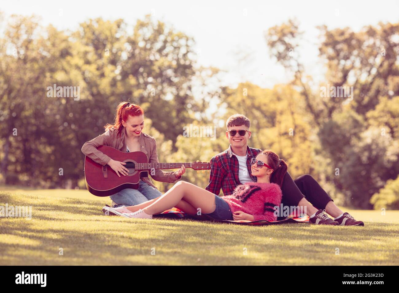 Best friends resting in park Stock Photo - Alamy