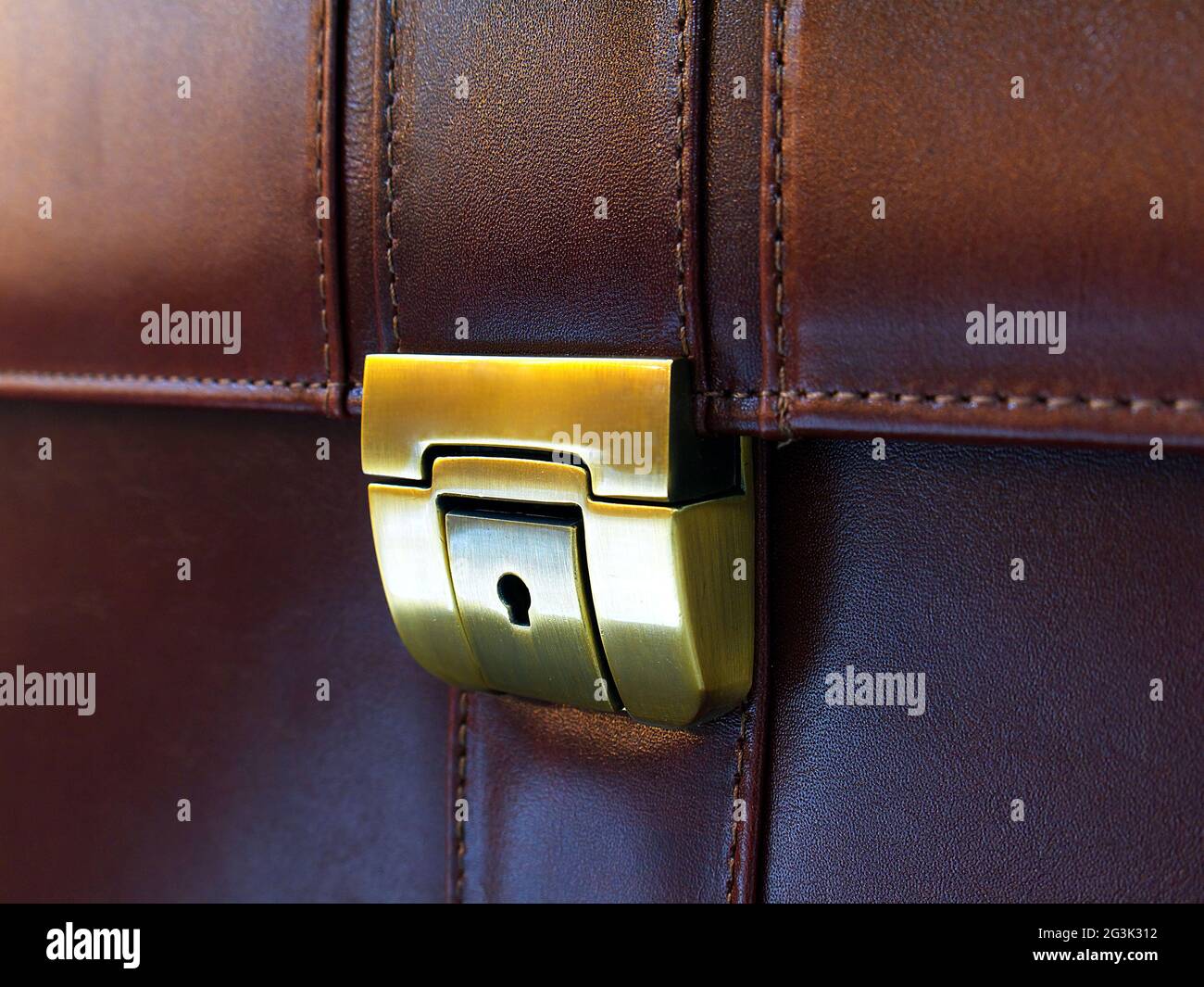 luxury brown leather briefcase lock closeup Stock Photo - Alamy