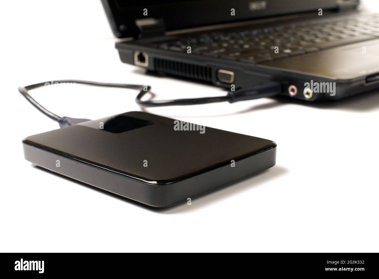 external usb disk connected to laptop on white background Stock Photo ...