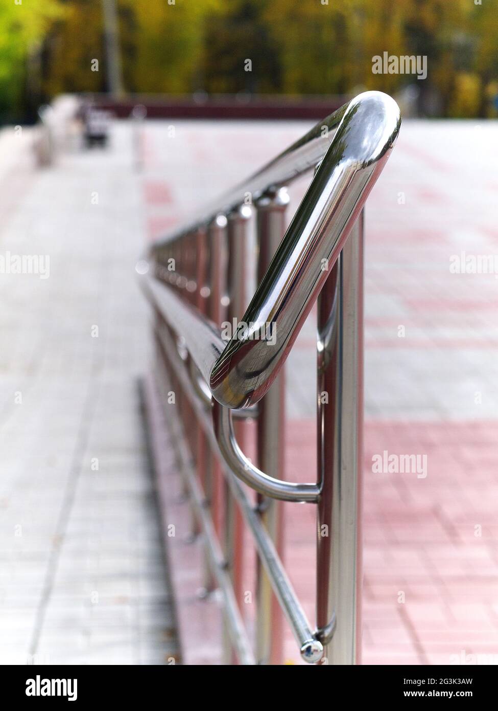 steel handrails of wheelchair ramp closeup Stock Photo - Alamy
