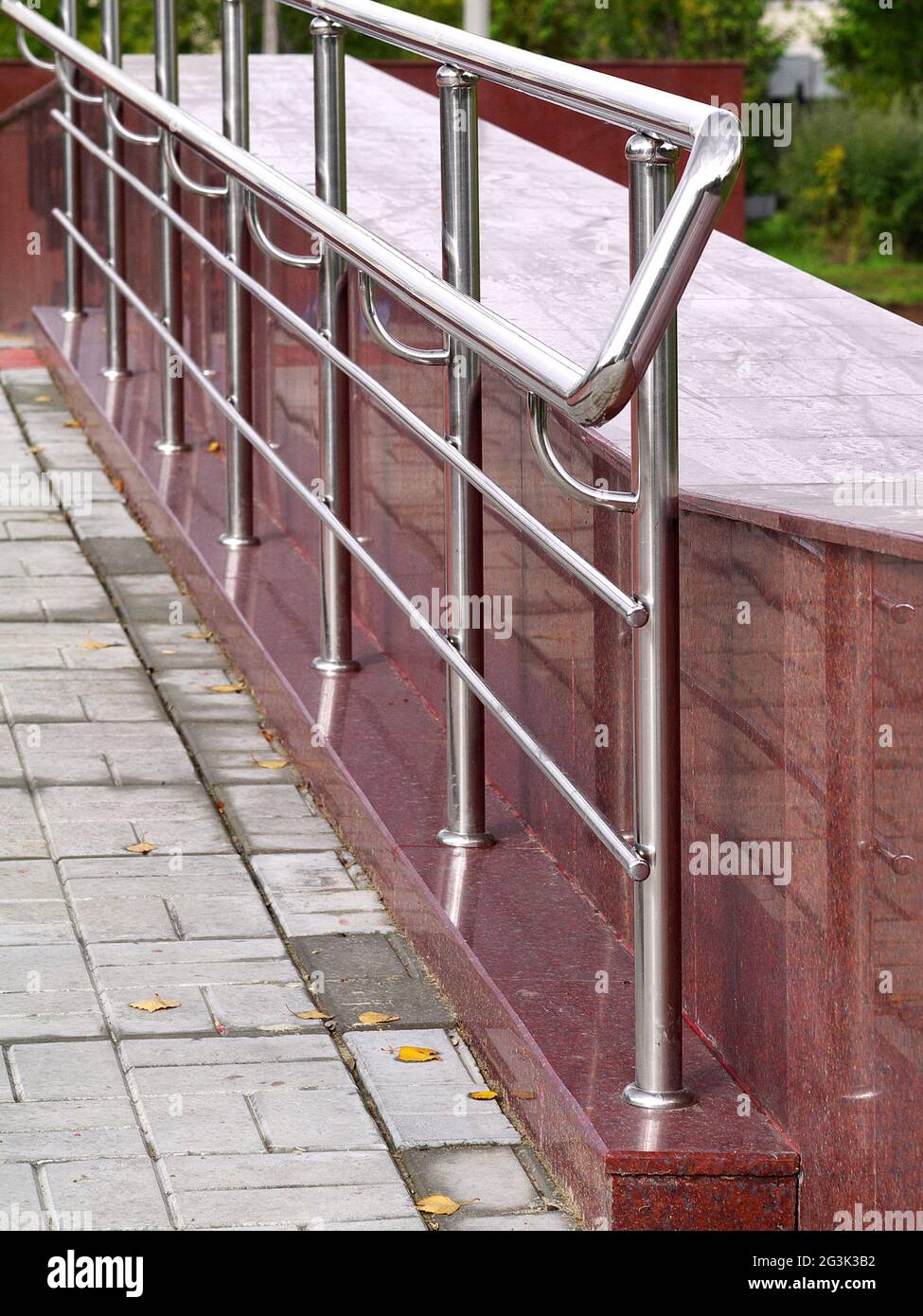 metal handrails of wheelchair ramp in city park Stock Photo - Alamy