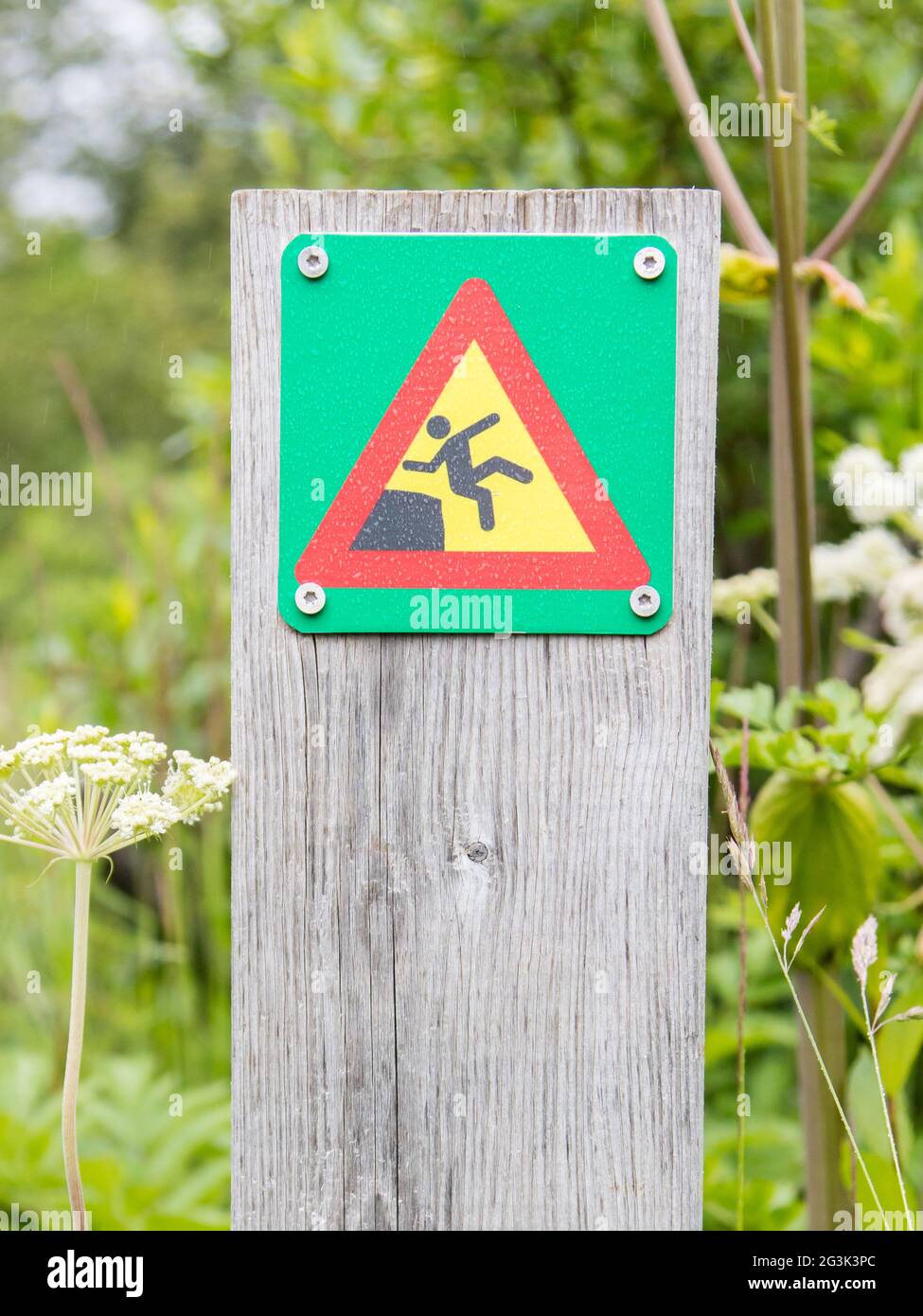 Green square sign - Warning for risk of falling Stock Photo - Alamy