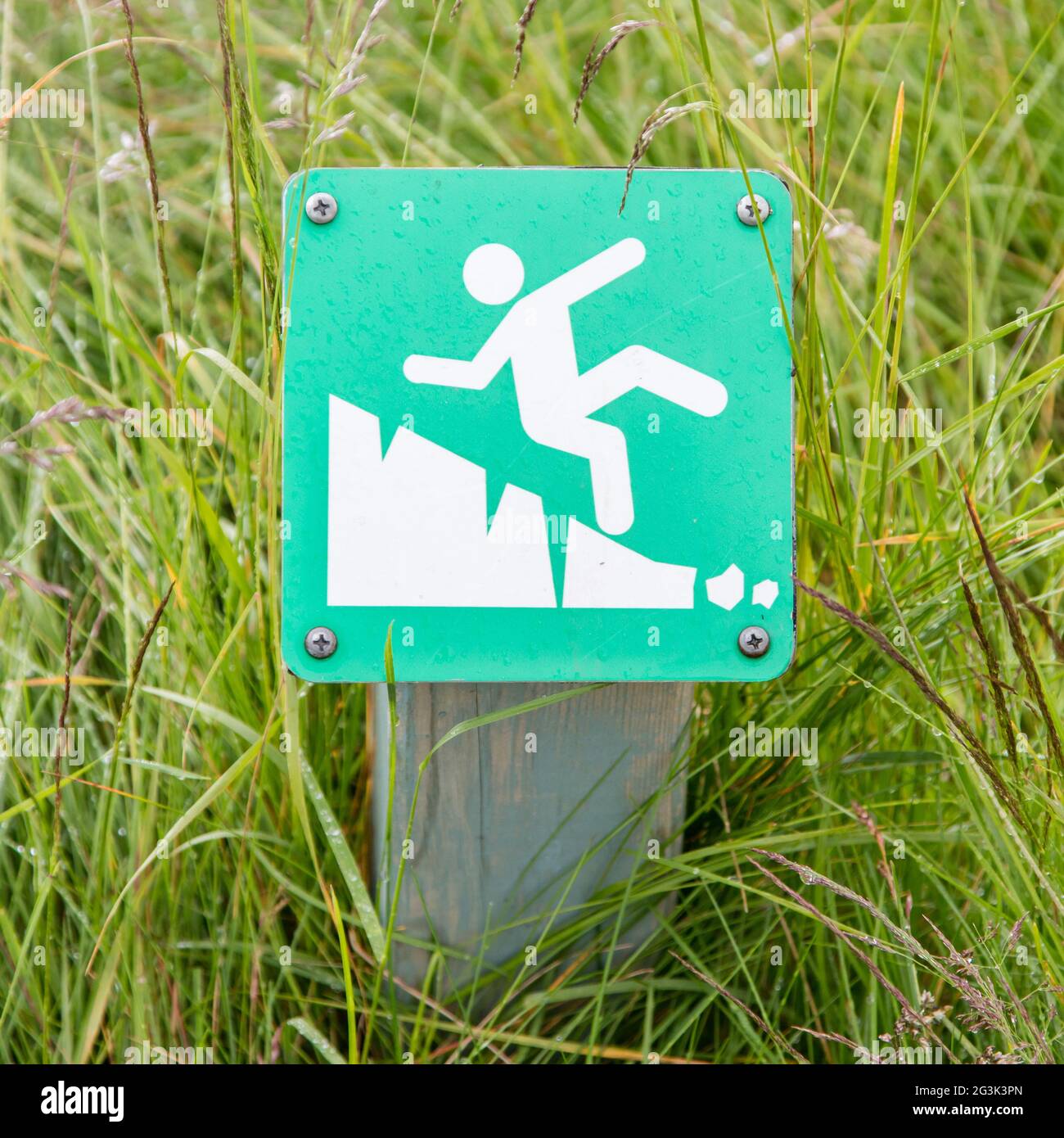 Green square sign - Warning for risk of falling Stock Photo - Alamy