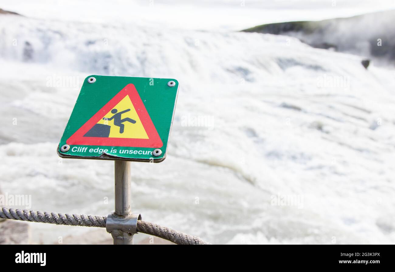 Green square sign - Warning for risk of falling Stock Photo - Alamy