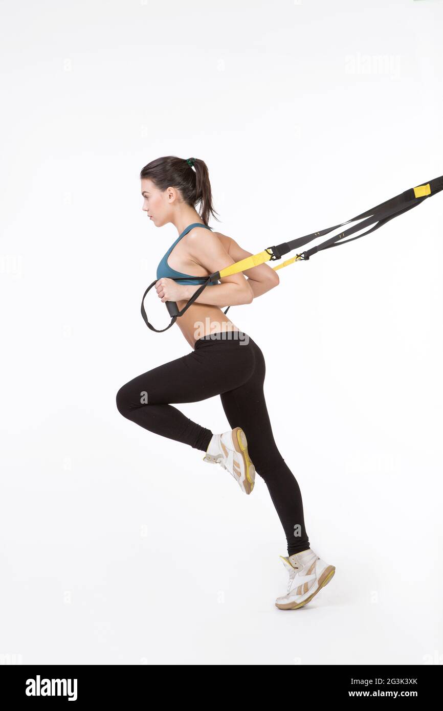 Woman training with suspension trainer sling Stock Photo - Alamy