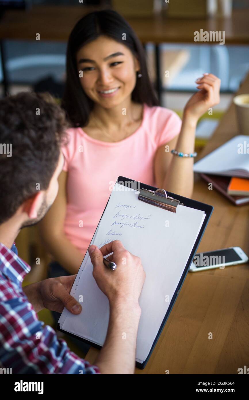 Beautiful lady having interview in restaurant Stock Photo - Alamy