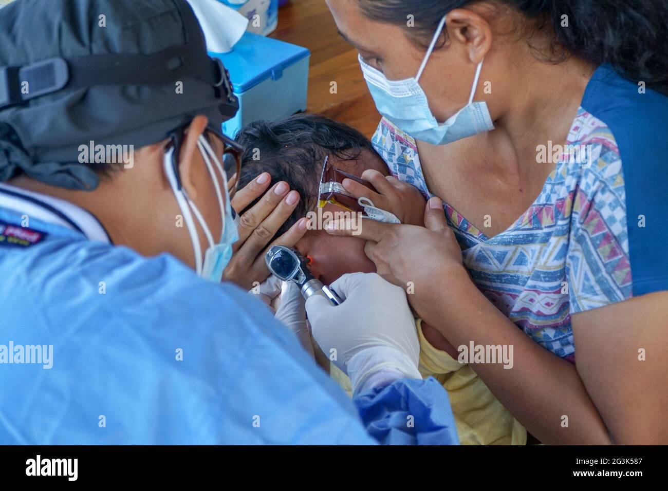 BALI/INDONESIA-MAY 28 2021: An ENT doctor is examining the ears, nose ...