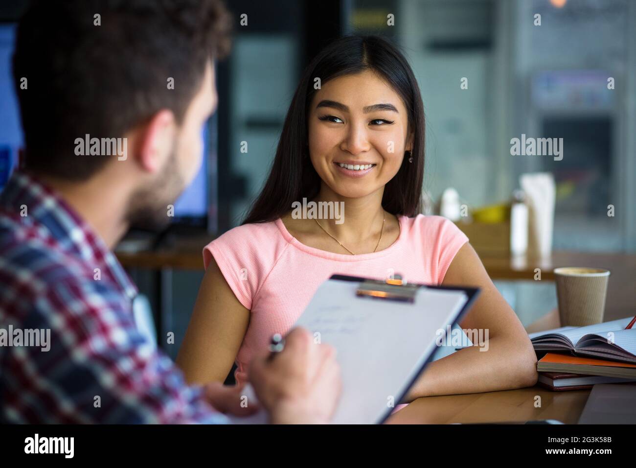 Beautiful lady having interview in restaurant Stock Photo - Alamy