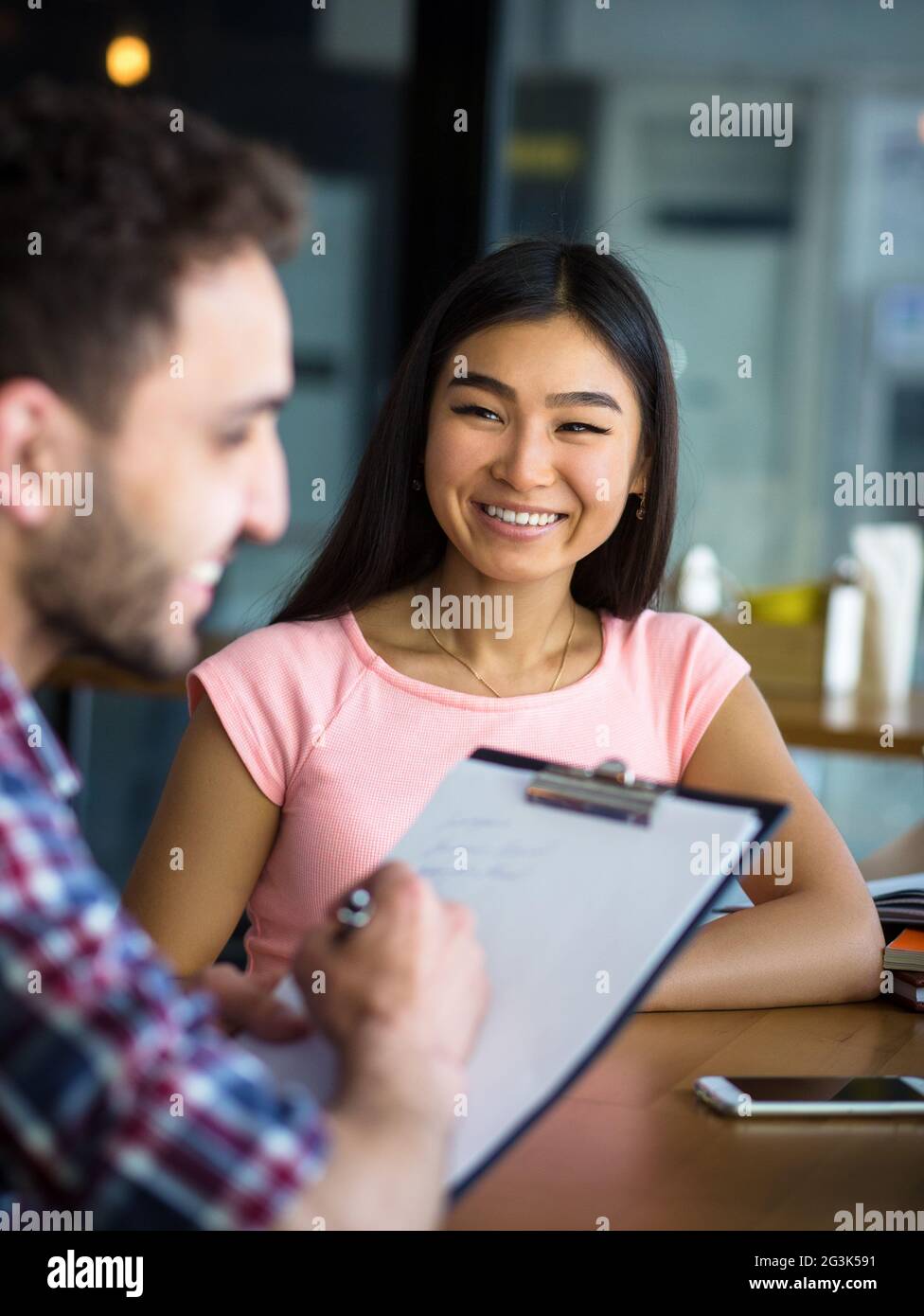 Beautiful lady having interview in restaurant Stock Photo - Alamy
