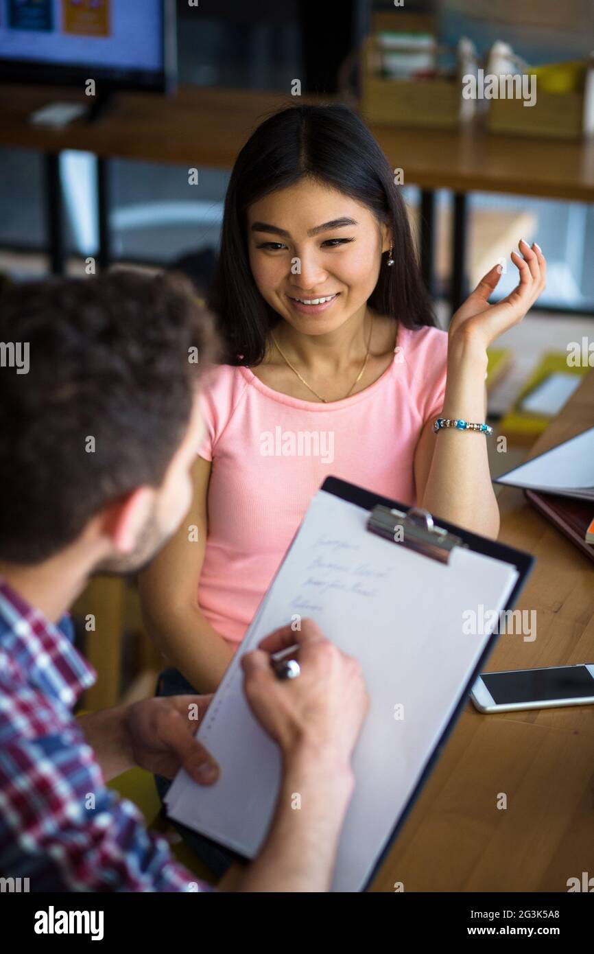 Beautiful lady having interview in restaurant Stock Photo - Alamy