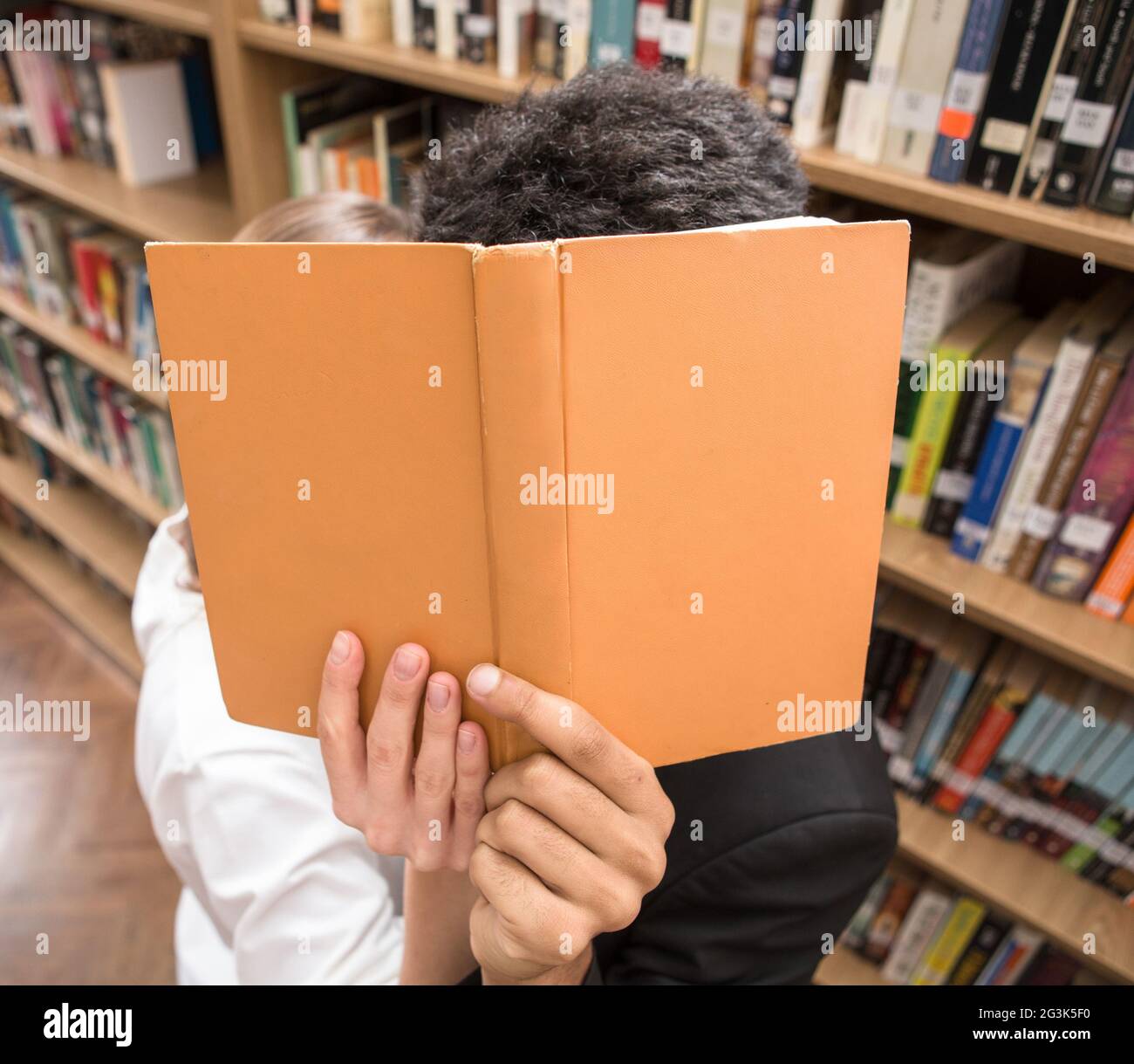 Two students reading in library hi-res stock photography and images - Alamy