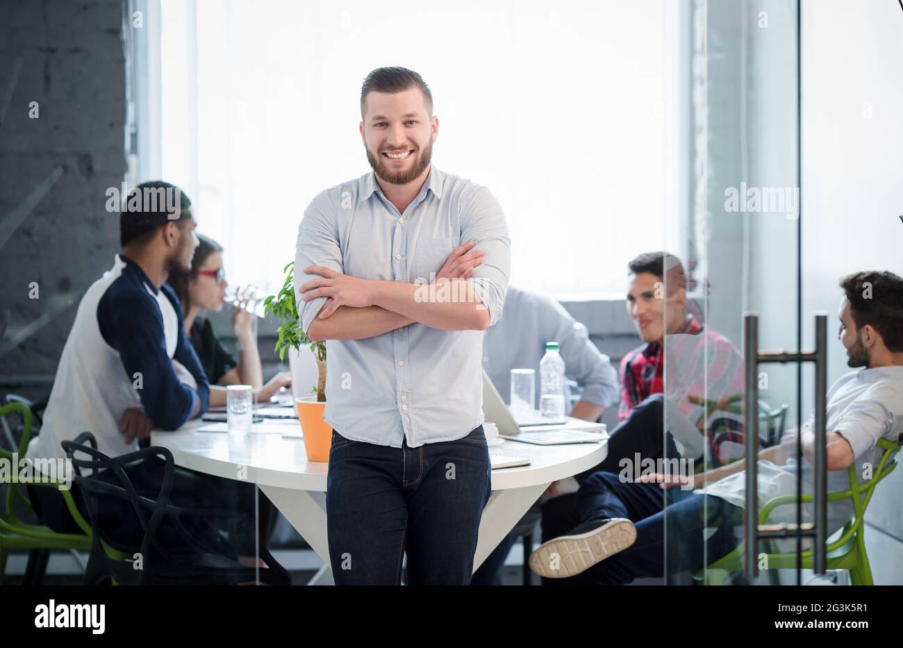Businessman in office interior Stock Photo - Alamy