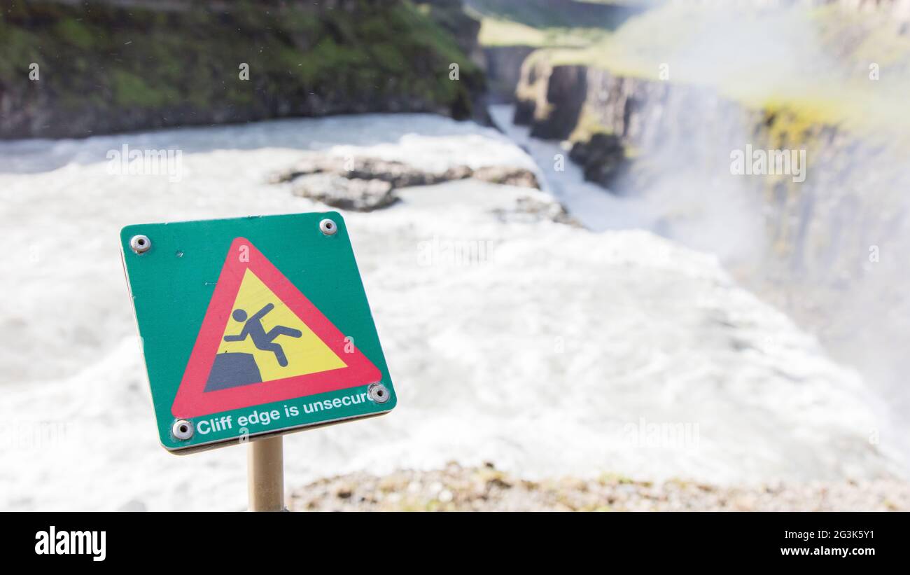 Green square sign - Warning for risk of falling Stock Photo - Alamy