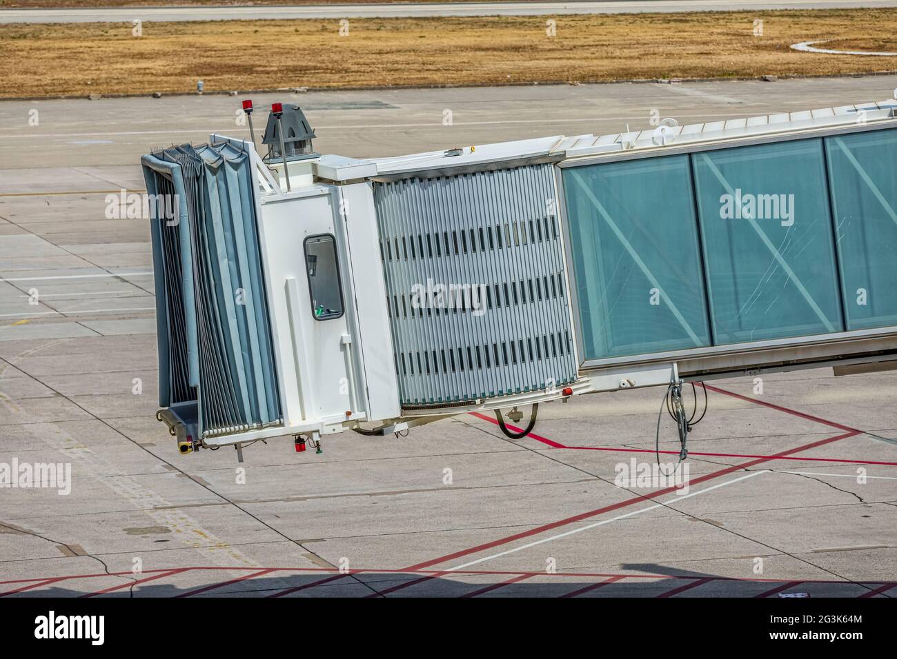 Passenger boarding bridge at the Airport waiting for the plane to ...