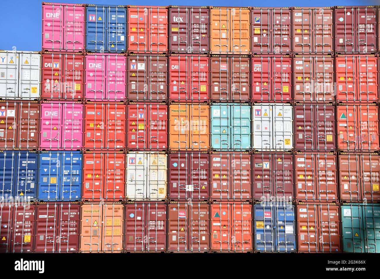 Shipping containers are loaded onto ships at the Port of Oakland ...